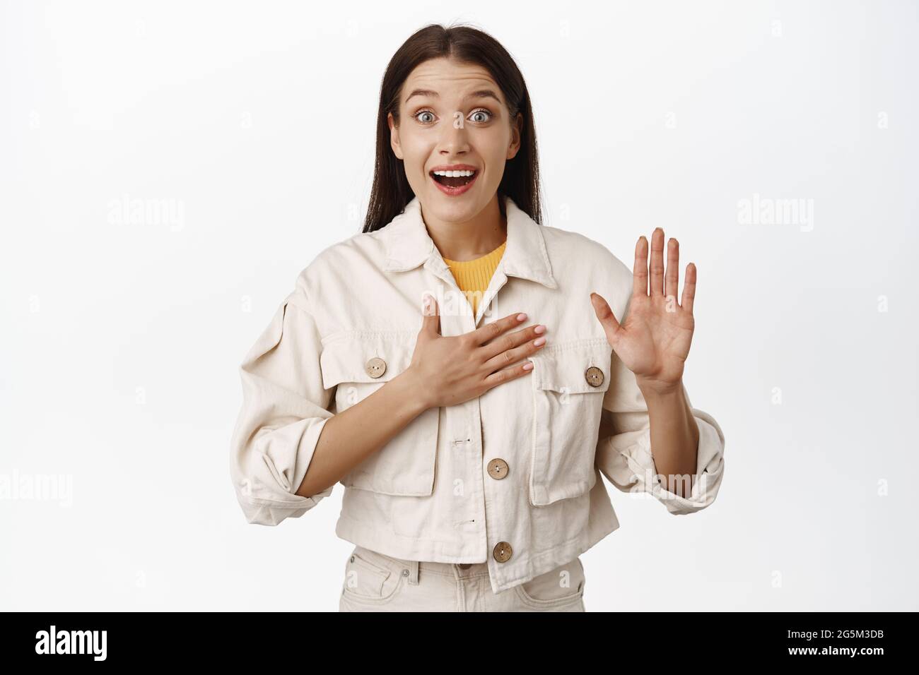 Portrait of excited woman look amazed, raising hand and put arm on ...