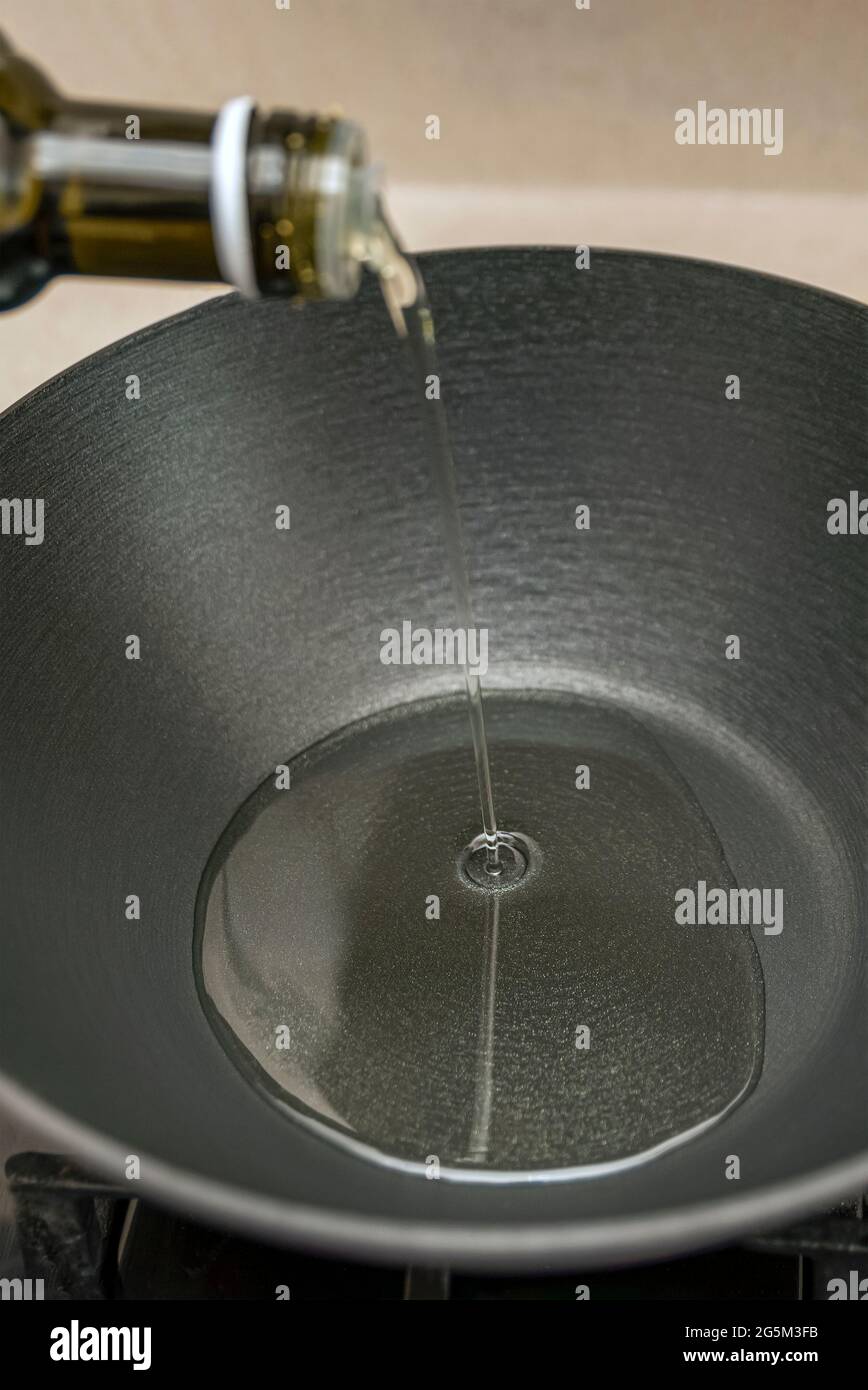 Cooking pilaf in a cauldron, a recipe for real pilaf. Olive oil for ...