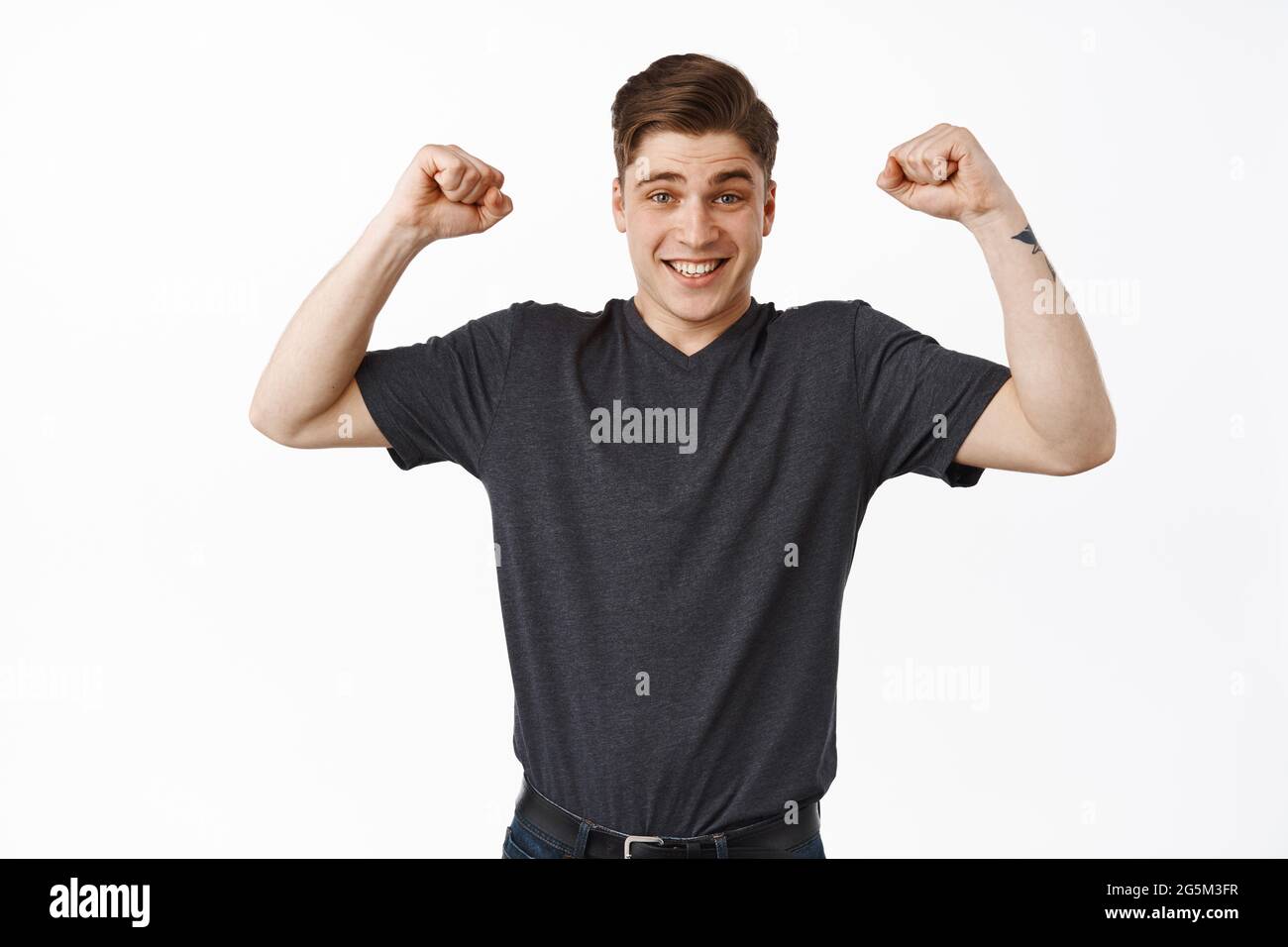 Excited young man winning, chanting and celebrating victory, raising ...
