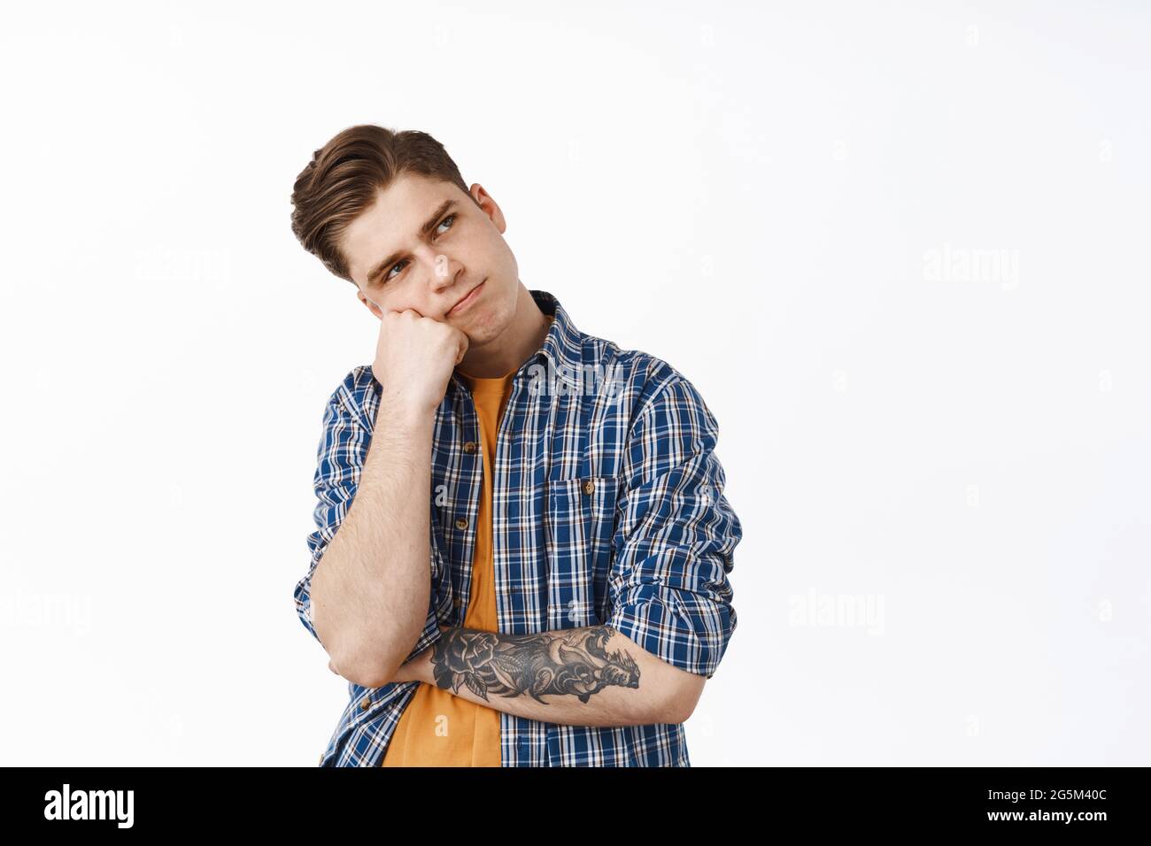 Sad and lonely man lean head on hand, looking aside bored or annoyed ...