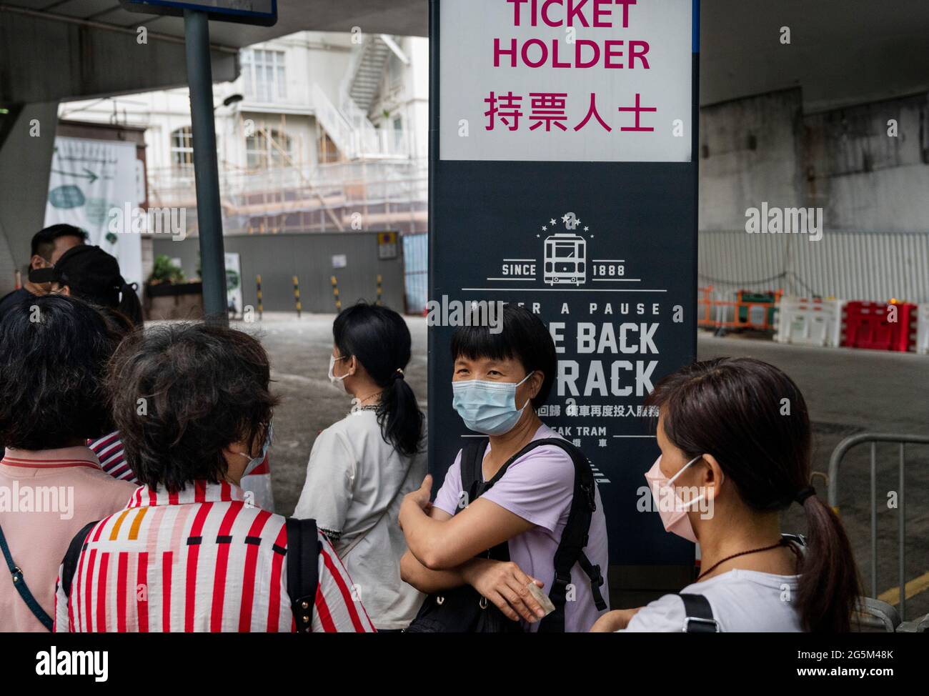 Passengers queue in line to enjoy the last Peak tram ride, operative ...