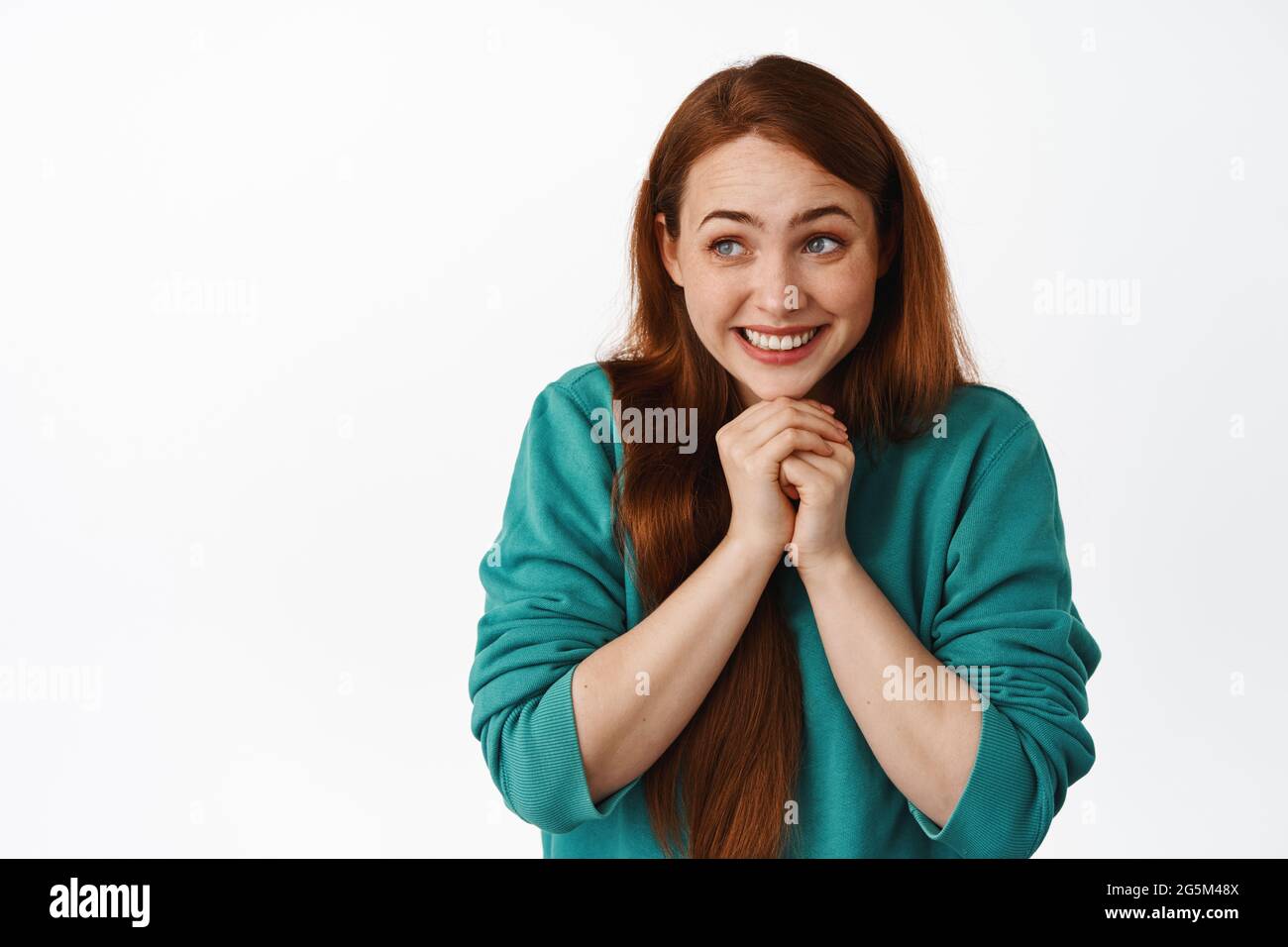 Beautiful ginger girl look with anticipation and joy, smiling and ...
