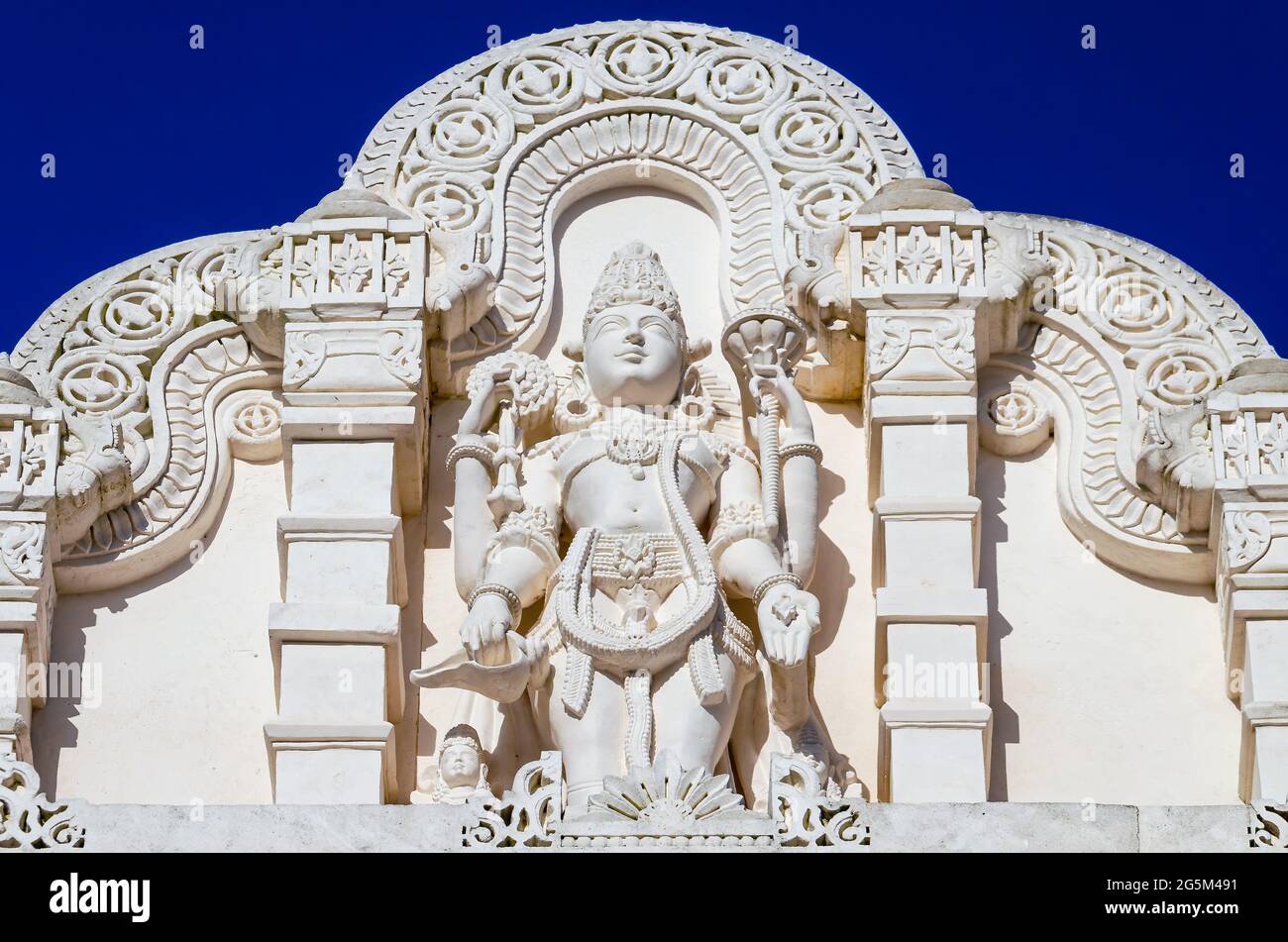 Hindu god Shiva carving displayed on the traditionalwall of a Hindu ...