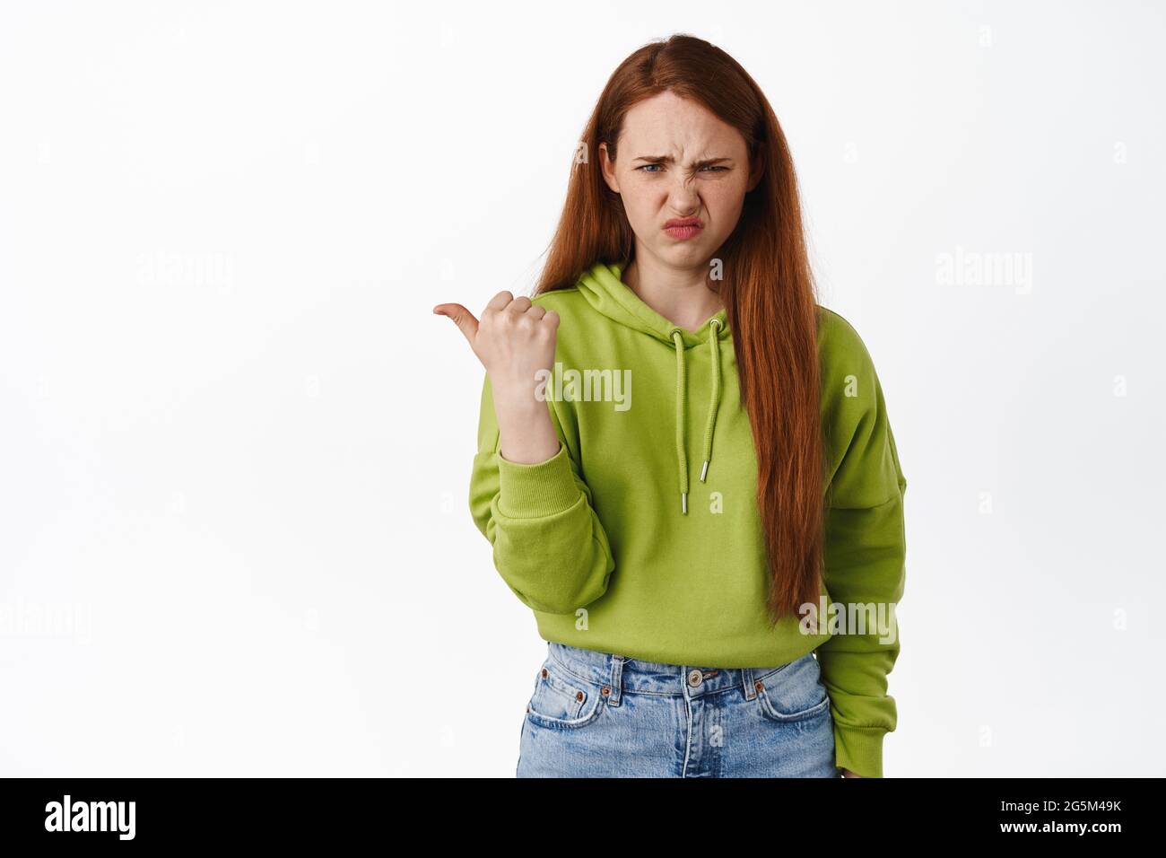 Sulking teen girl with red hair, grimacing and cringe reluctant ...