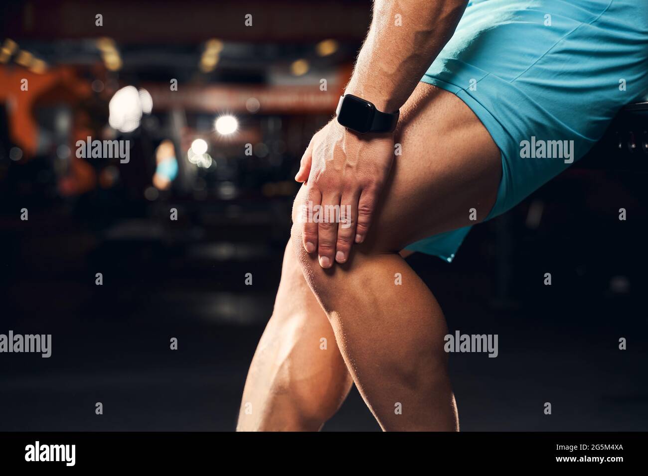 Tired sportsman experiencing discomfort from knee pain Stock Photo - Alamy