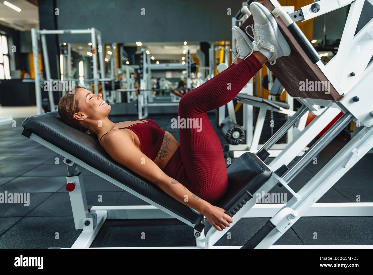 Image of concentrated pretty young woman fitness coach making sport ...