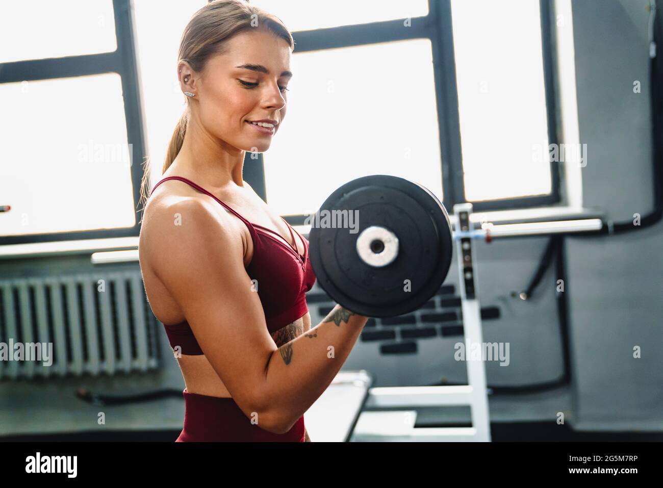 Image of cheery positive young woman fitness coach making sport ...