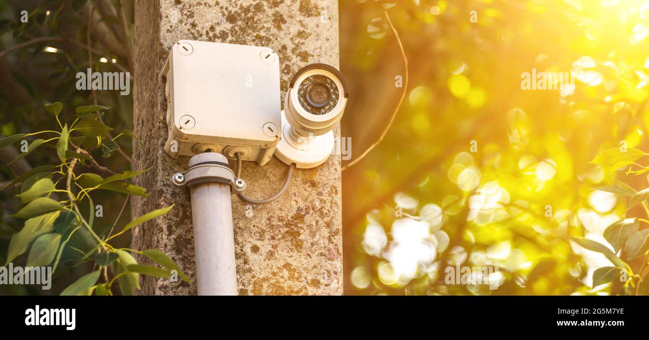 Outdoor CCTV monitoring, banner, security cameras with sunlight flare ...