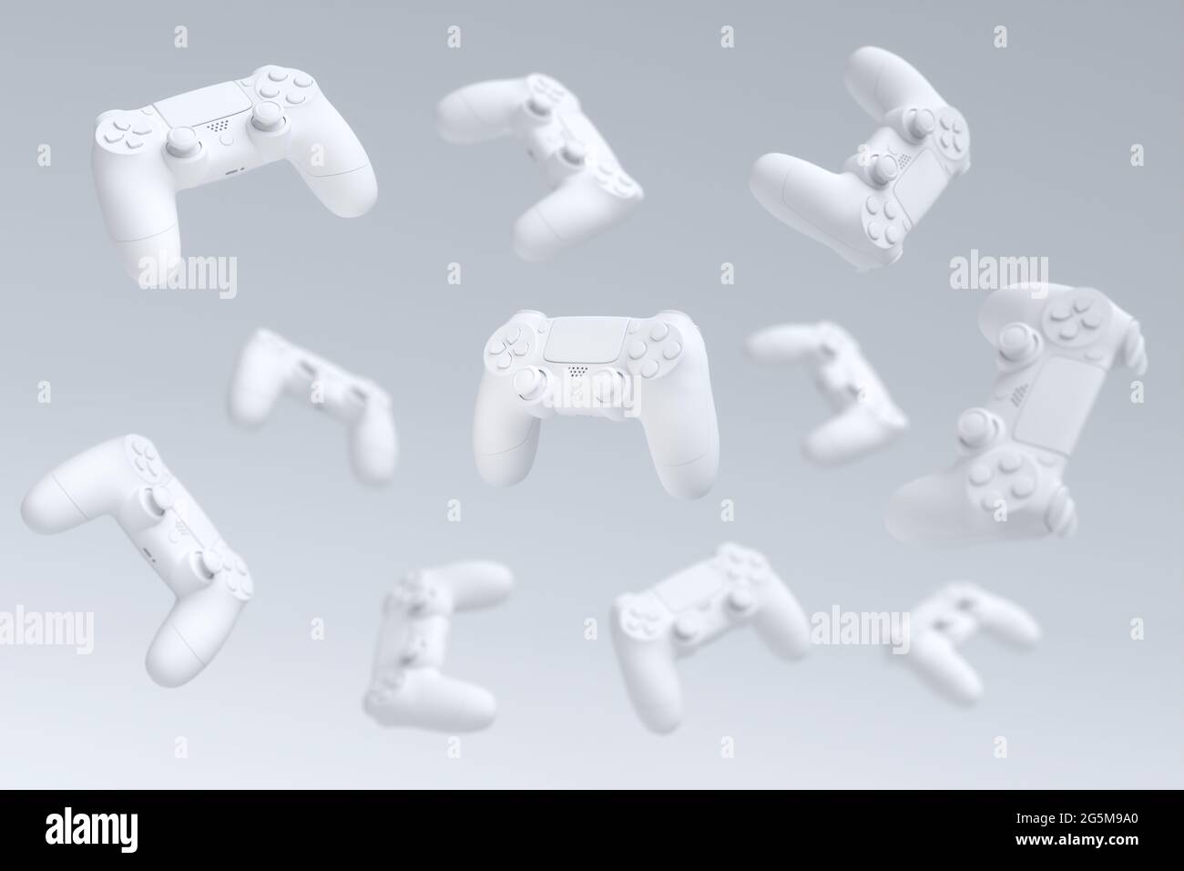 Flying gamer joysticks or gamepads on white background with blur Stock ...