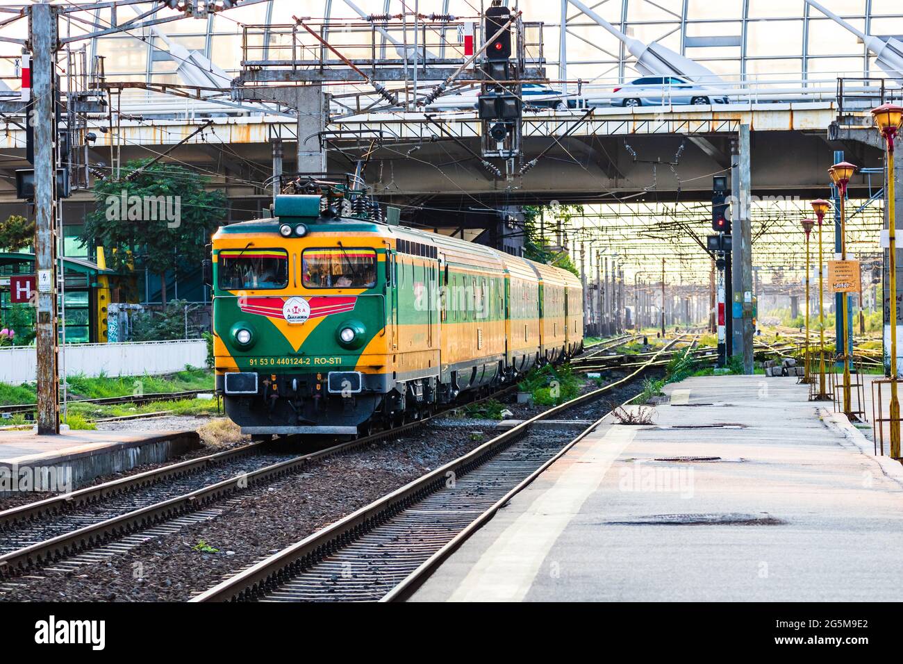 Detail of train in motion at train platform at Bucharest North Railway ...