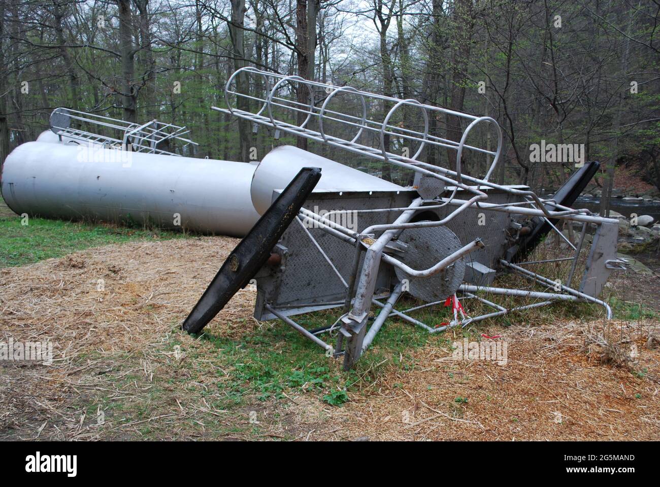 Shot of a wrecked metal equipment on the ground Stock Photo - Alamy