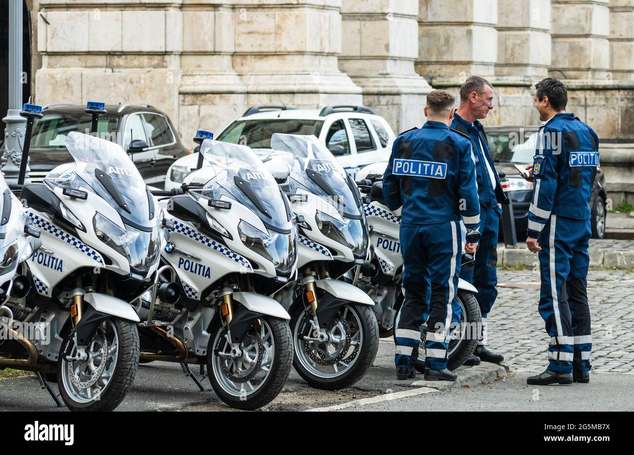 Police agent on motorcycle, Romanian Police (Politia Rutiera) car ...