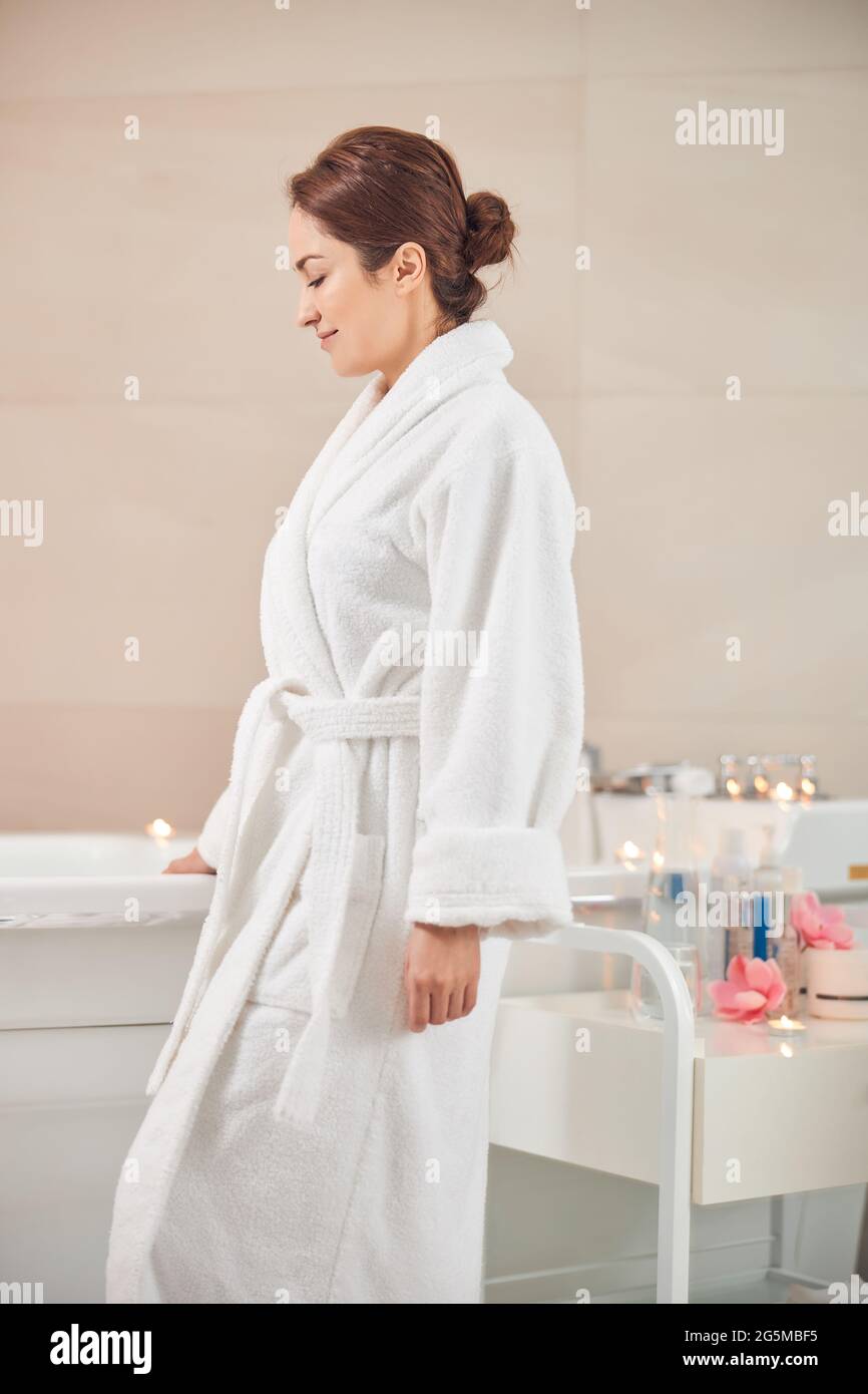 Cute Caucasian woman is staying alone in spa salon Stock Photo - Alamy