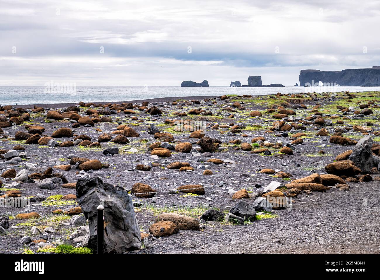 Vik, Iceland Reynisfjara black sand beach ocean horizon an rock ...