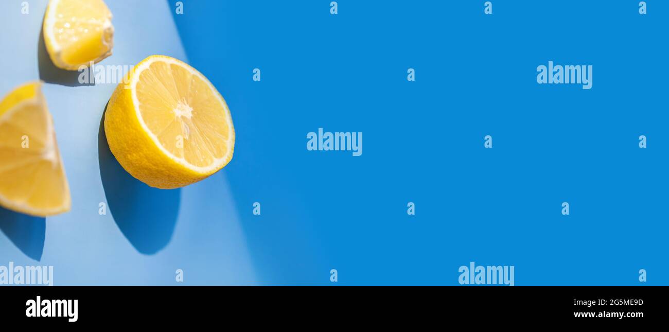 Modern abstract composition of lemon slices on blue background Stock ...