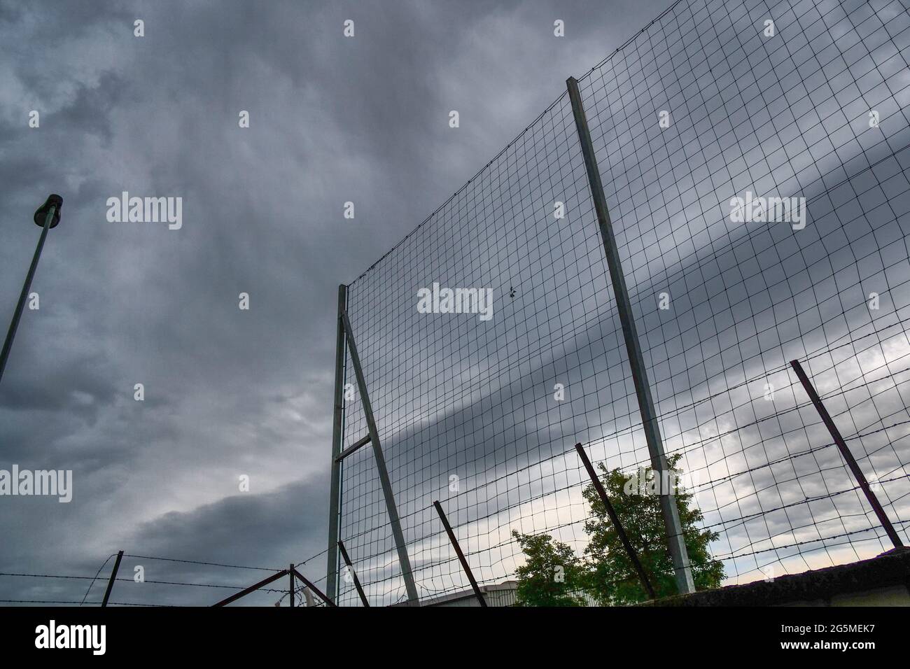 Fishnet and barbed wire fences, Conceptual photography, France Stock ...