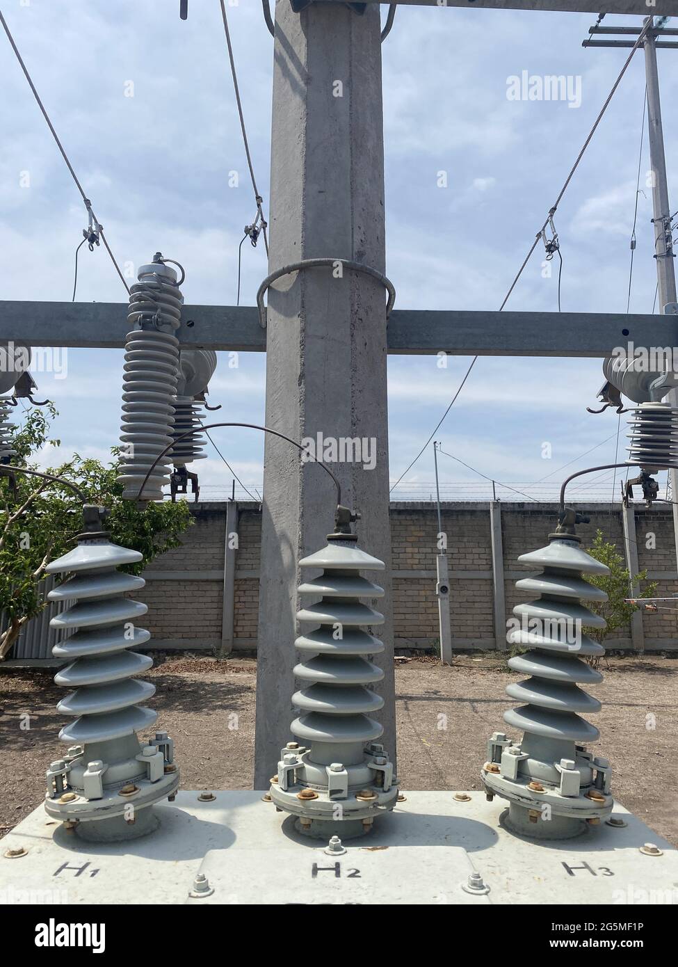 Closeup of electric insulators on a pole Stock Photo - Alamy
