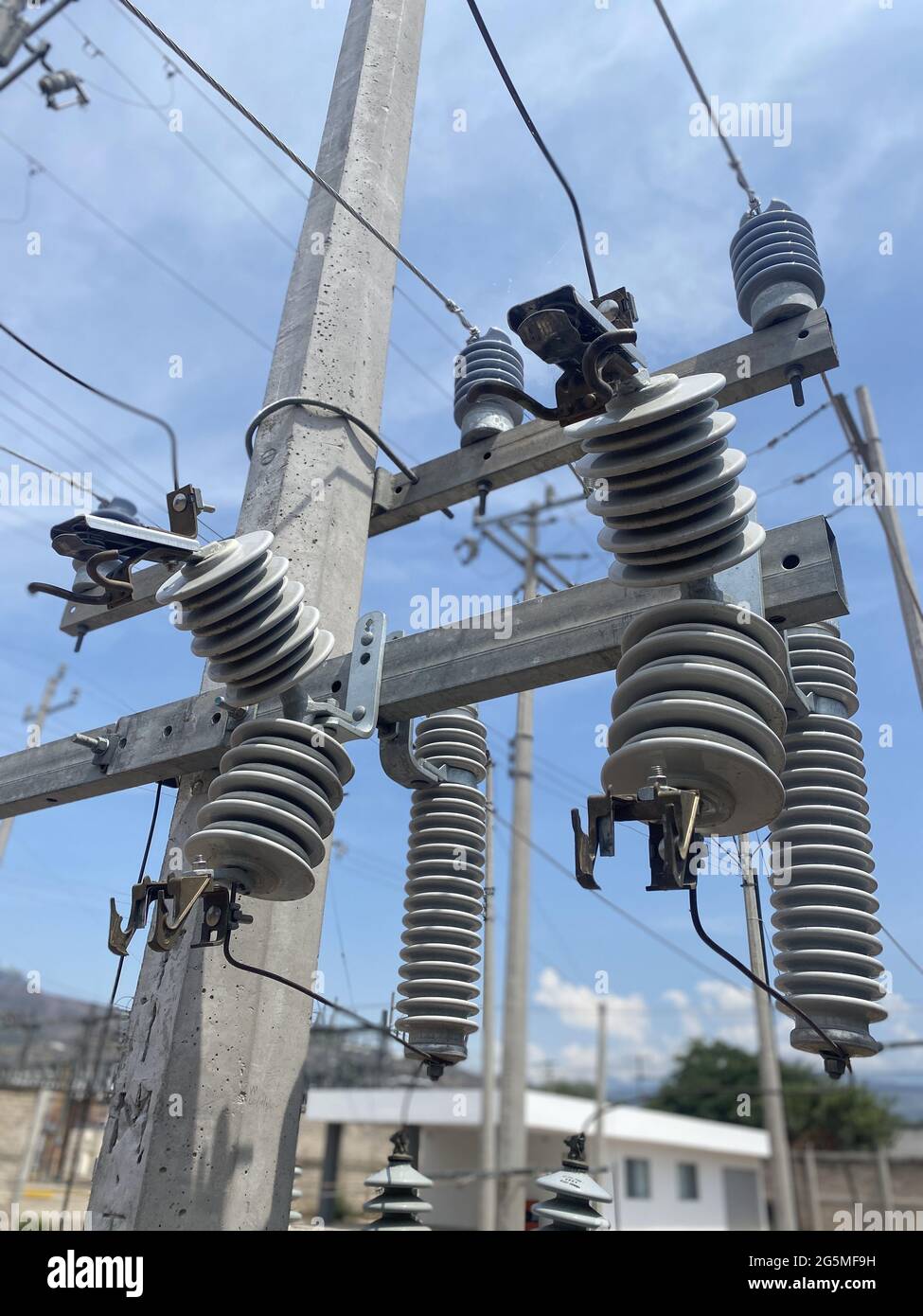 Closeup of electric insulators on a pole Stock Photo - Alamy