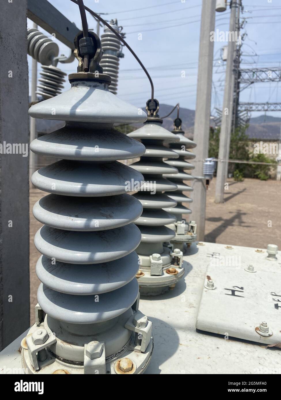 Closeup of electric insulators on a pole Stock Photo - Alamy