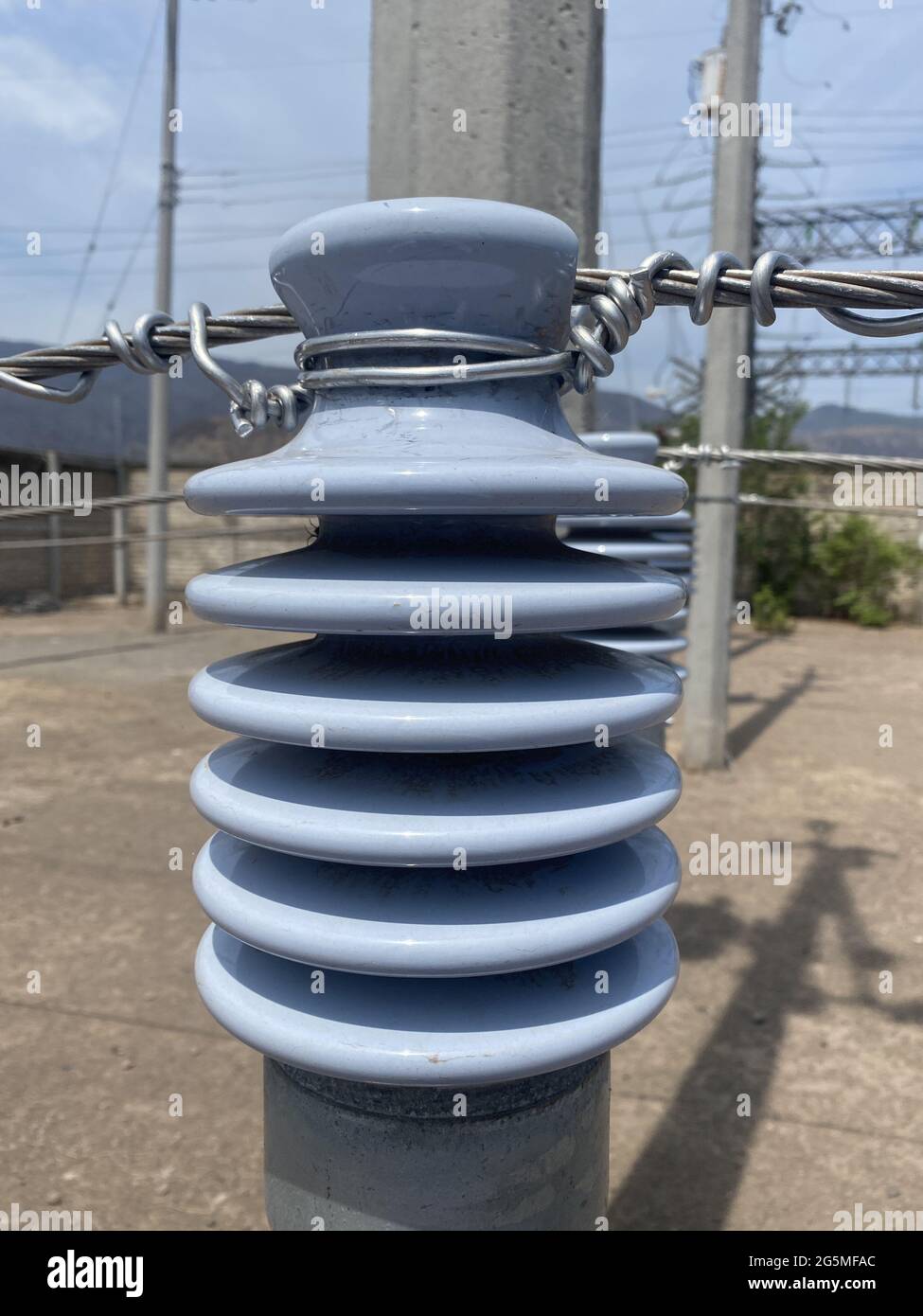 Closeup of an electric insulator on a pole Stock Photo - Alamy