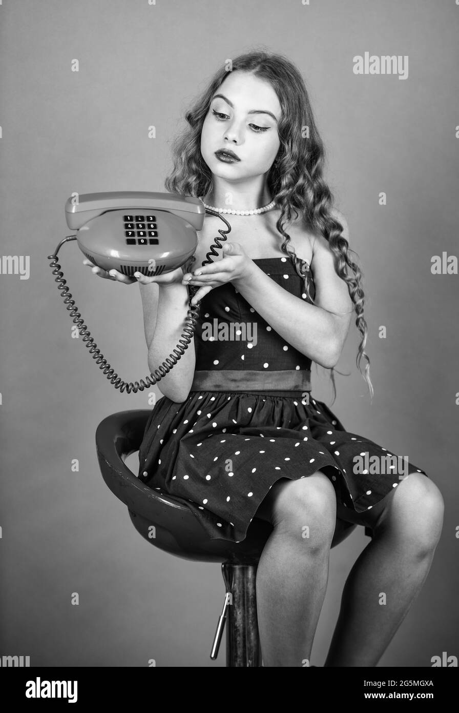Confident beauty. pinup girl happy conversation. kid sit on chair dial ...