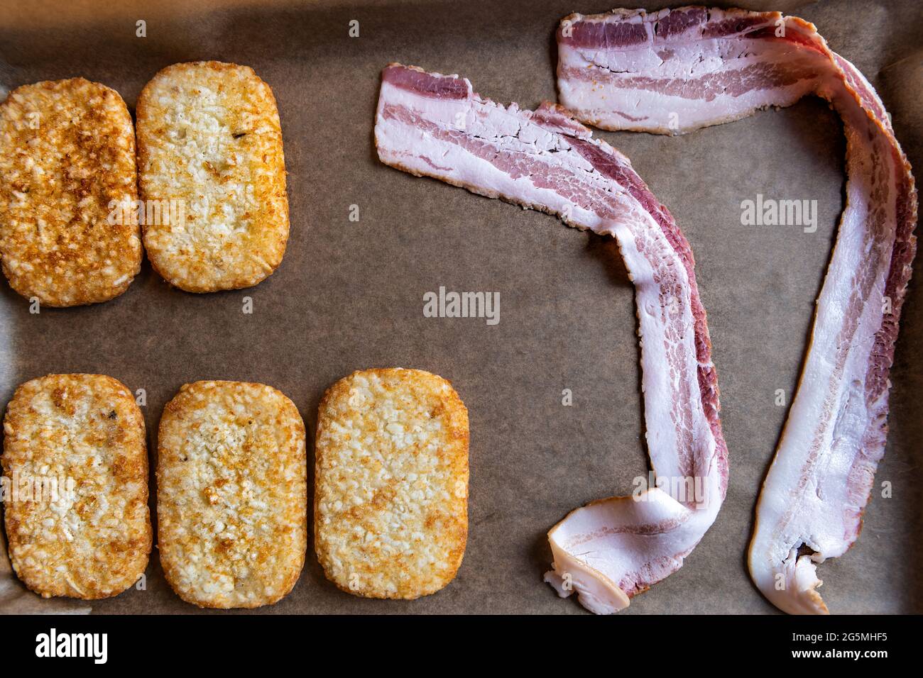 Flat top lay of baking sheet with parchment paper for hash browns ...