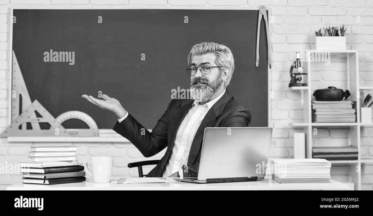 School teacher programming laptop. Learn programming language. Handsome ... School teacher programming laptop. Learn programming language. Handsome ...