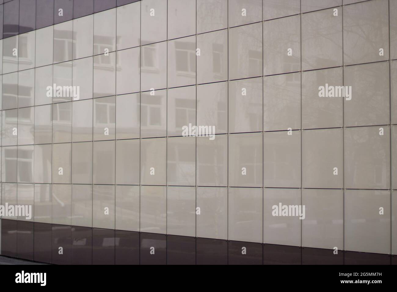 A wall of tiles. The wall of the building. Front tiles in architecture ...