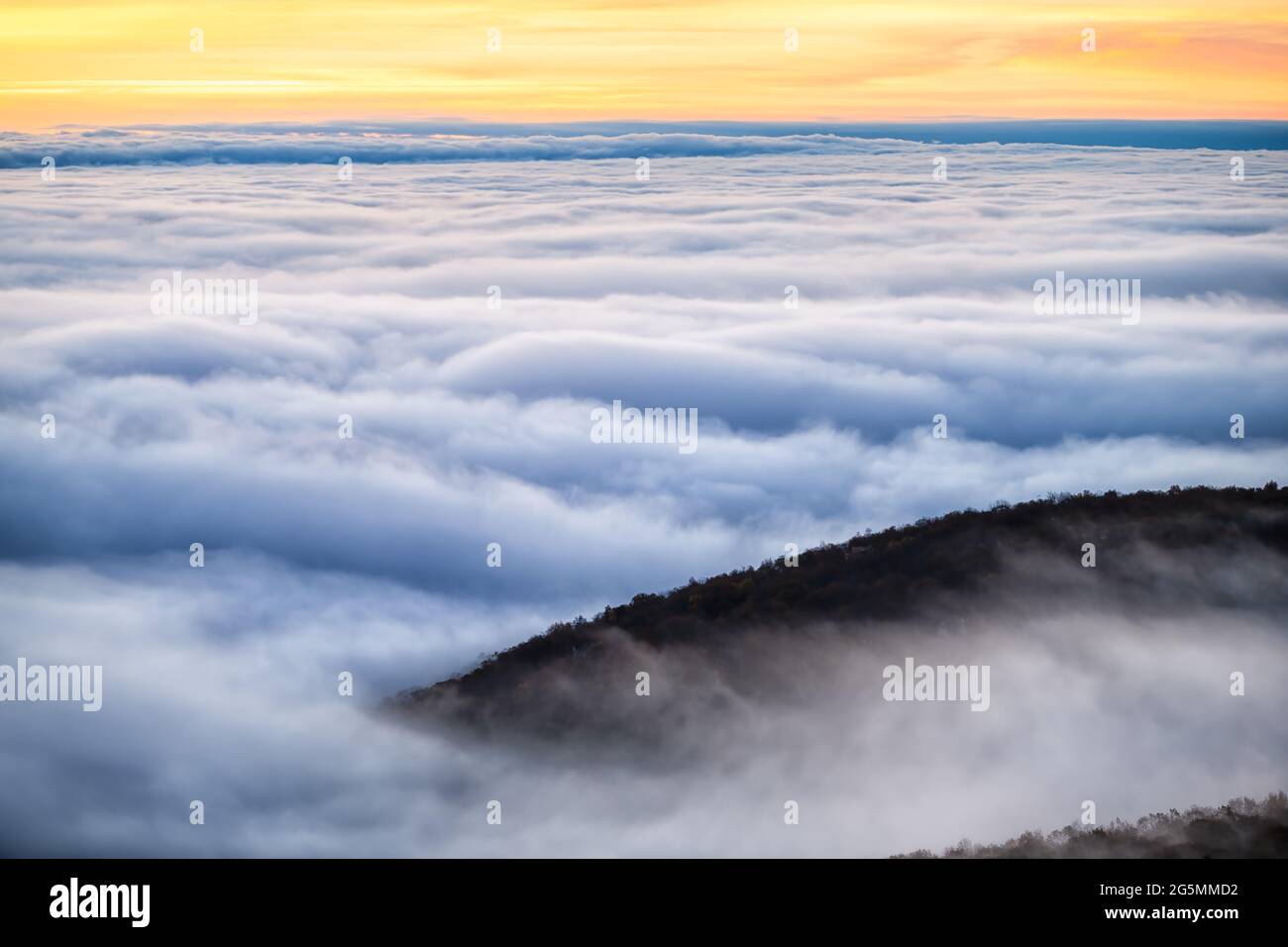 Clouds mist fog covering mountain peak in Wintergreen resort town in ...