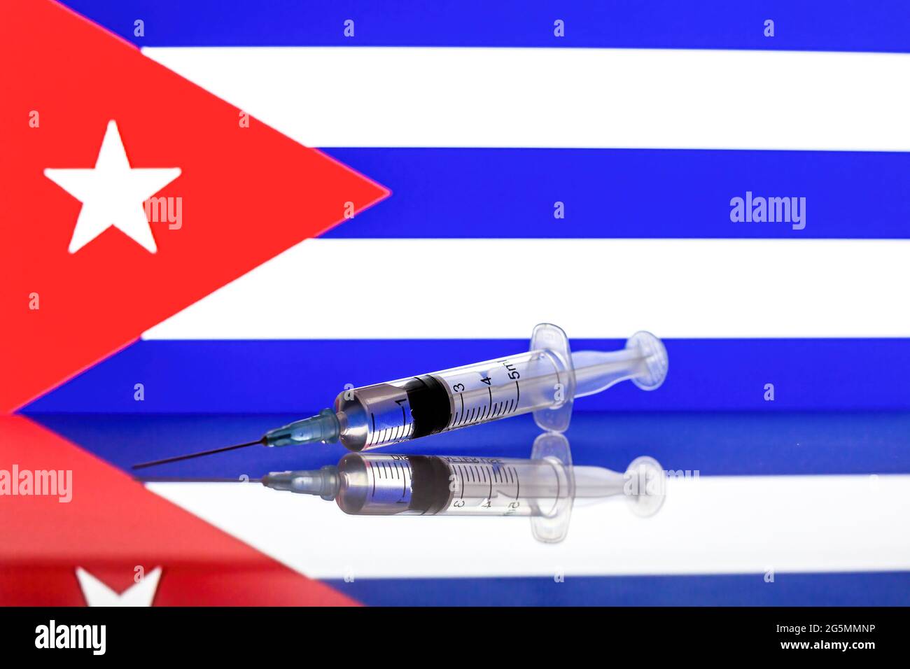 In this photo illustration a medical syringe seen displayed in front of ...