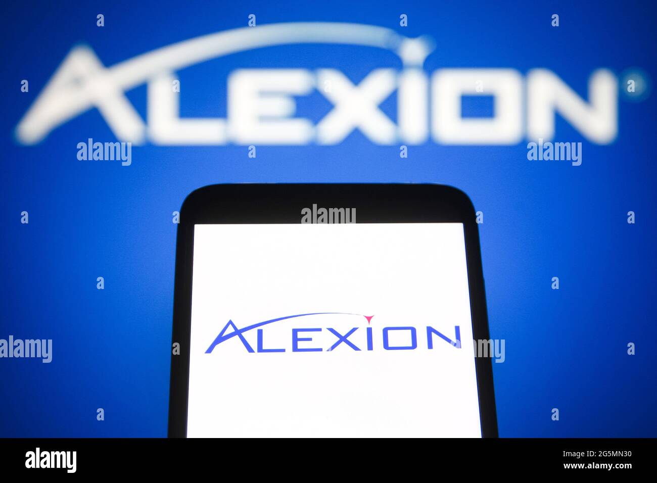 In this photo illustration, Alexion Pharmaceuticals logo is seen on a ...