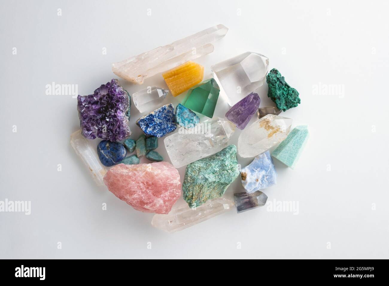 Crystals and gemstones on a w ite background. Flat lay of colorful ...