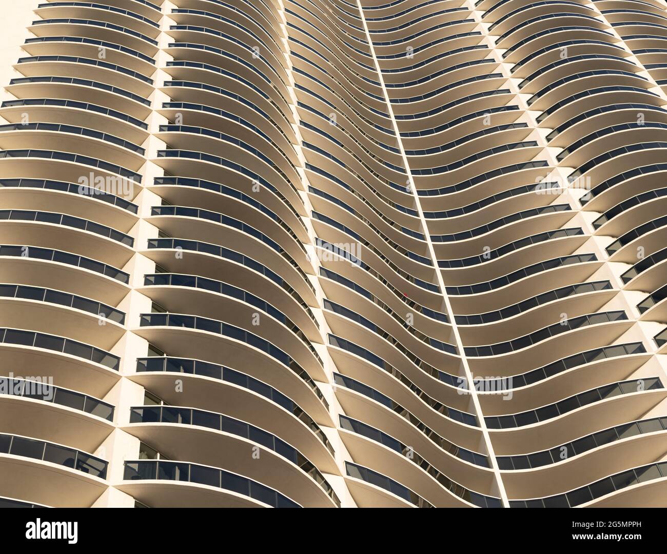 perspective view on skyscraper with balconies in modern city, city ...
