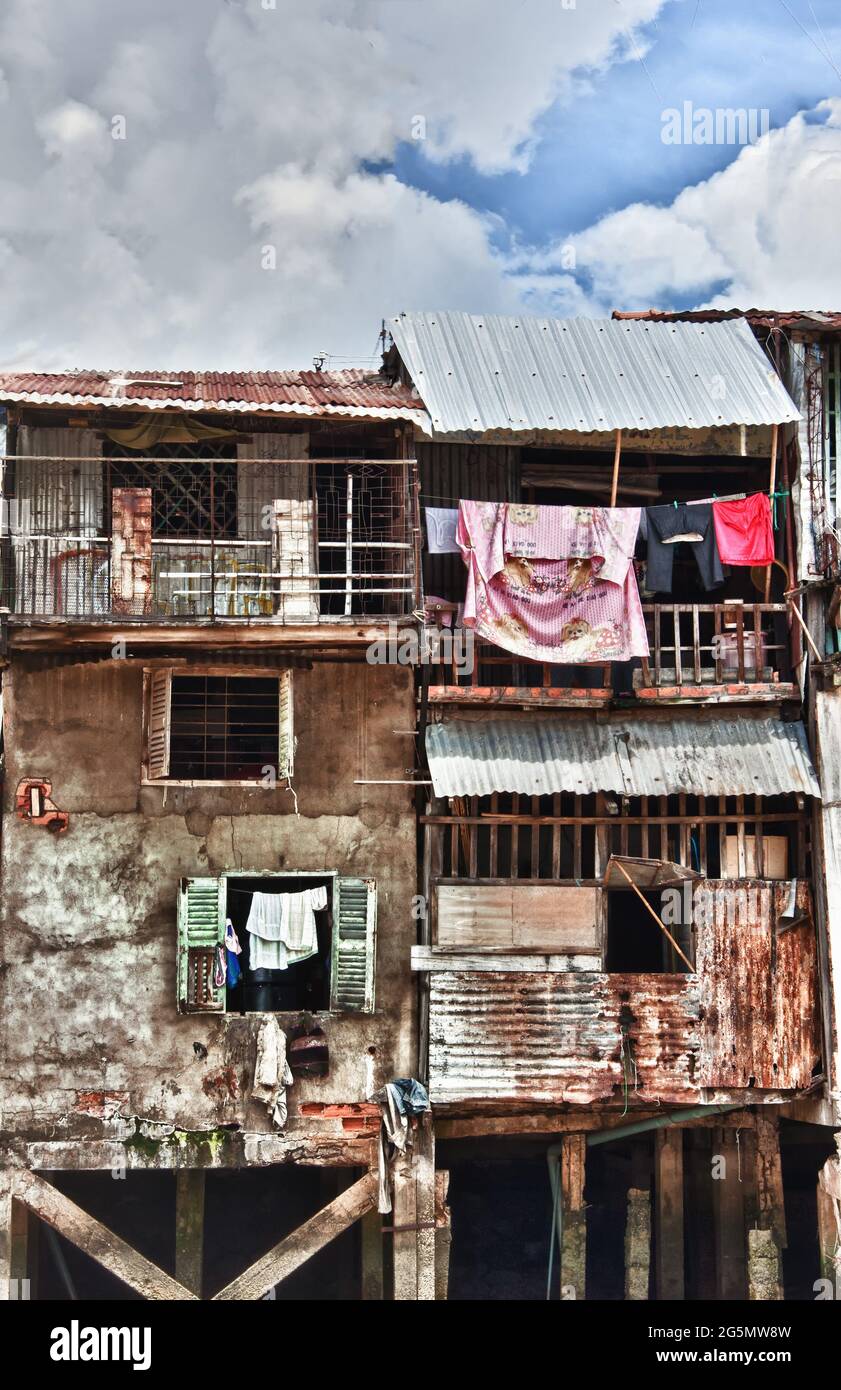 Old housing along the Mekong Delta in VIetnam with laundry hanging on ...