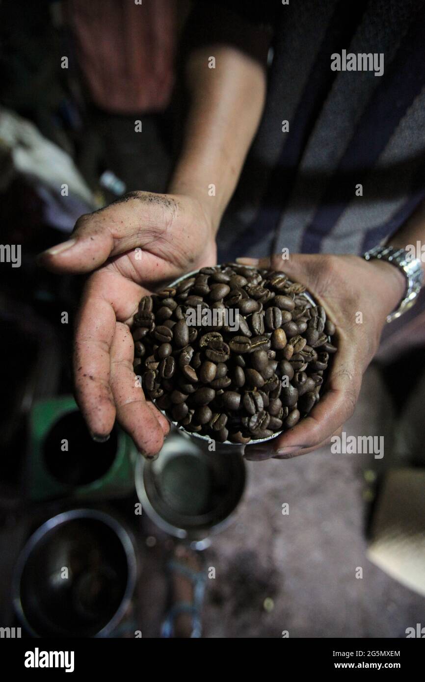 Roasted arabica coffee beans at a coffee processing and coffee vendor ...