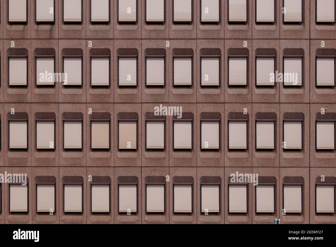 Outdoor exterior front view of modern earth tone pale red stone granite ...