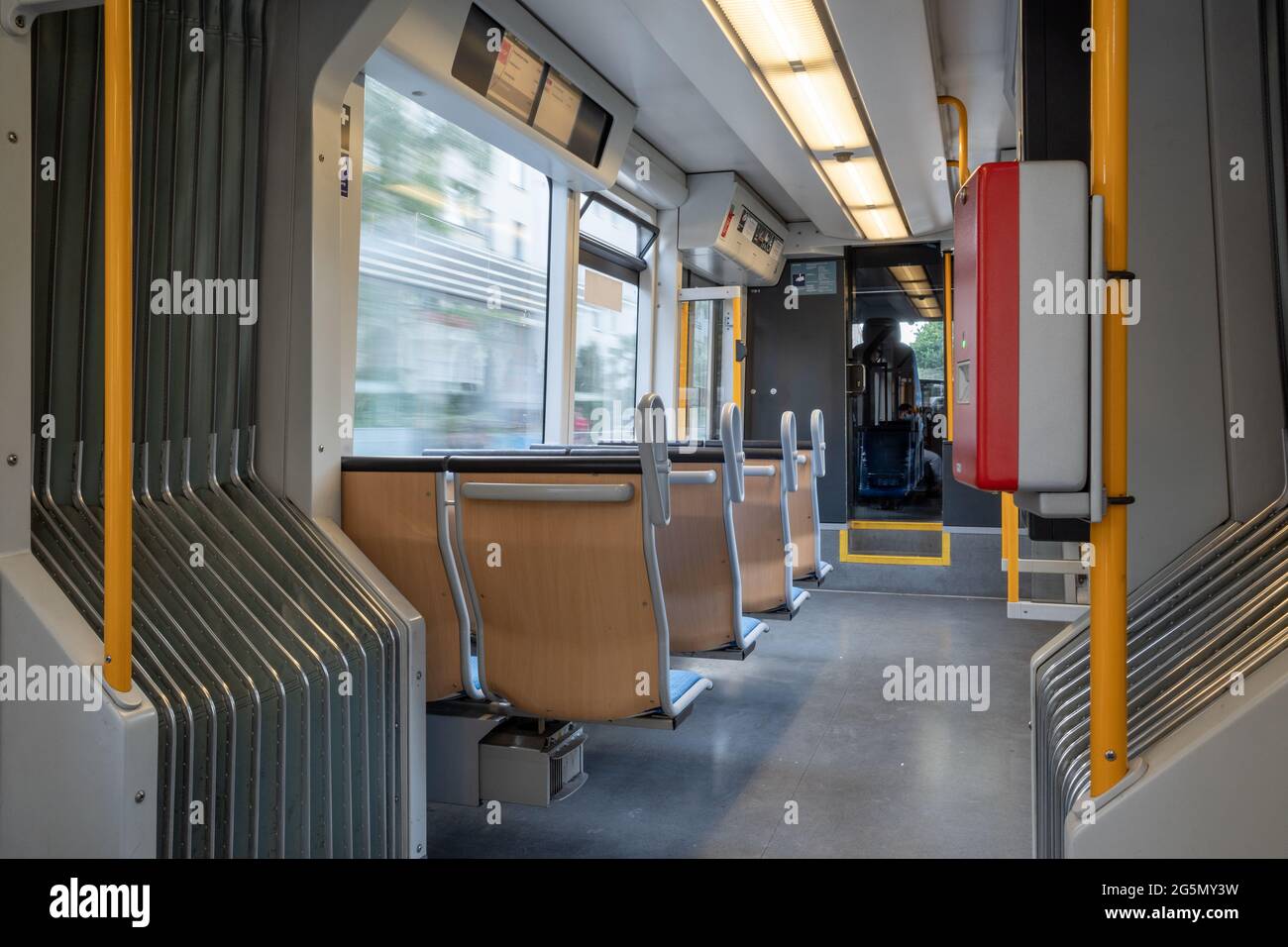 Interior view of a corridor inside passenger trains with blue fabric ...