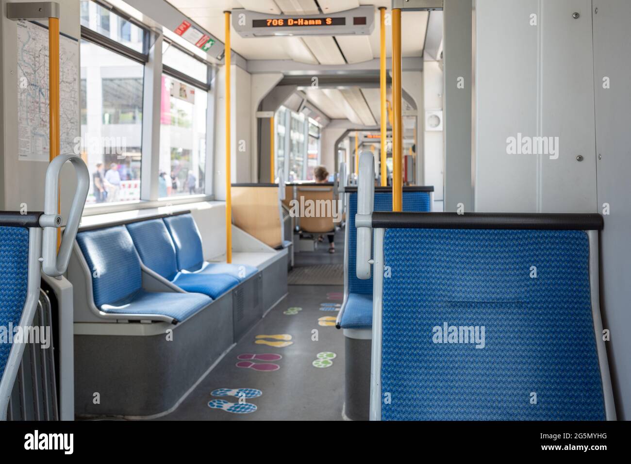 Interior view of a corridor inside passenger trains with blue fabric ...