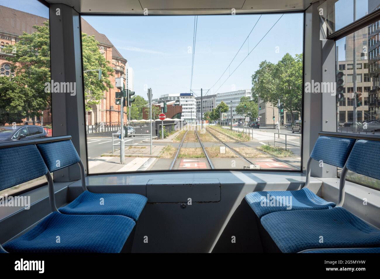 Interior view of a corridor inside passenger trains with blue fabric ...