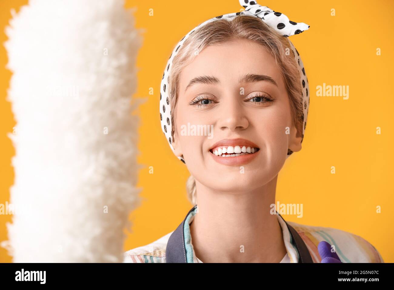 Girl with feather duster hi-res stock photography and images - Alamy