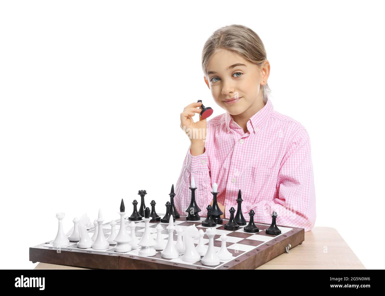 Cute little girl playing chess on white background Stock Photo - Alamy