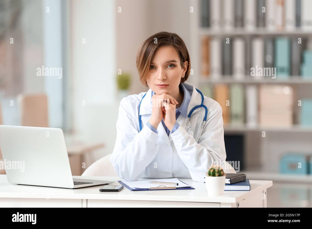 Female doctor working in clinic Stock Photo - Alamy