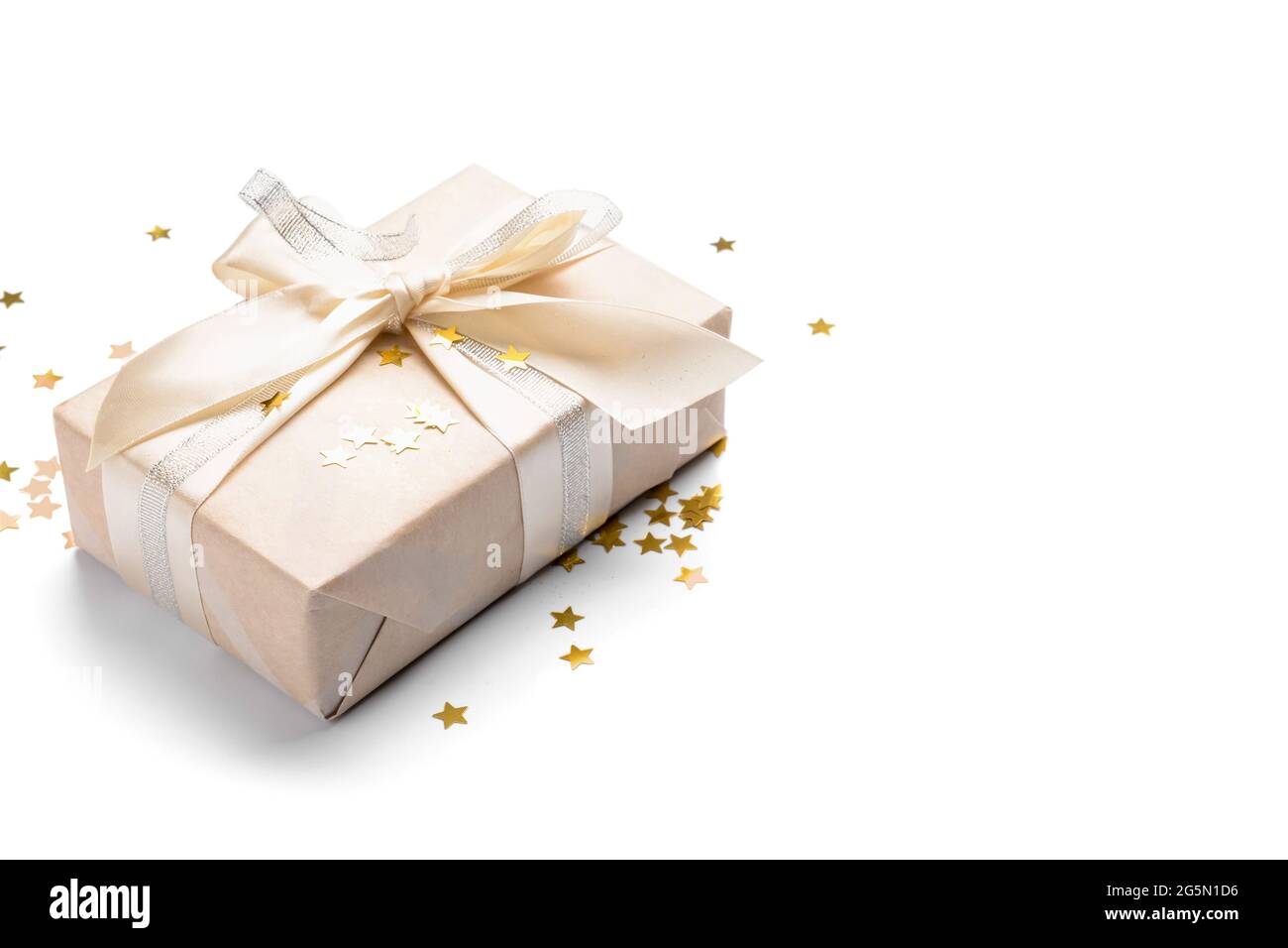 Gift box with confetti on white background Stock Photo - Alamy