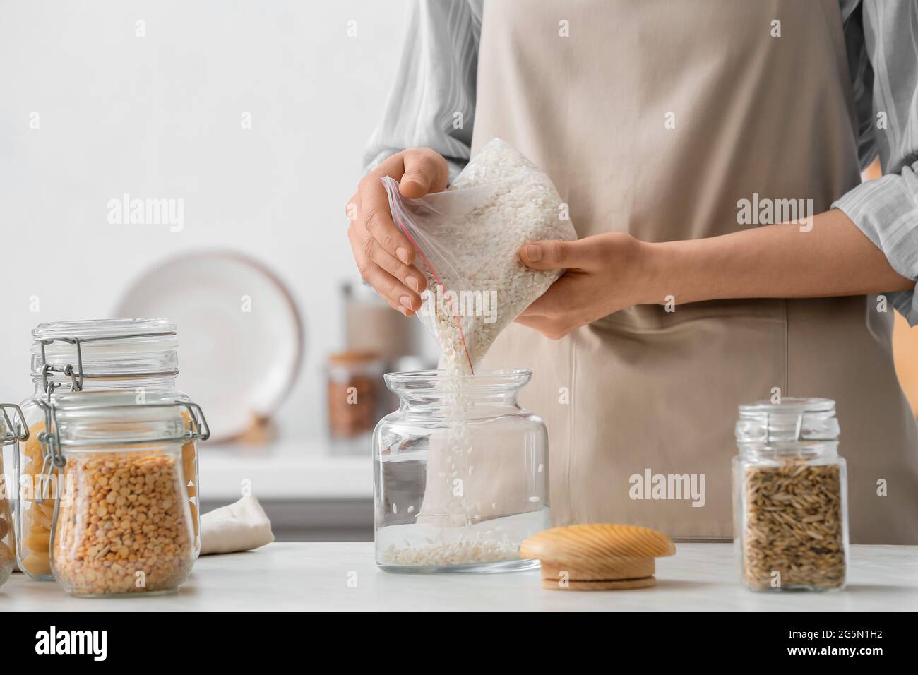 Pouring rice container hi-res stock photography and images - Alamy