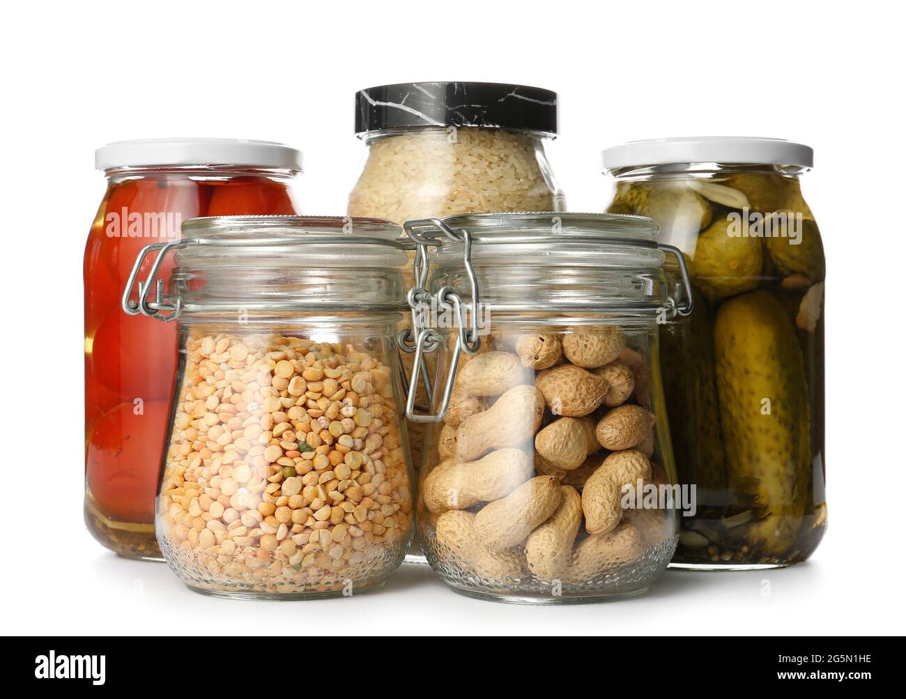 Glass jars with different products on white background Stock Photo - Alamy
