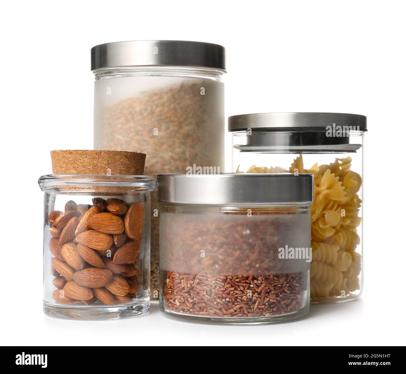 Glass jars with different products on white background Stock Photo - Alamy
