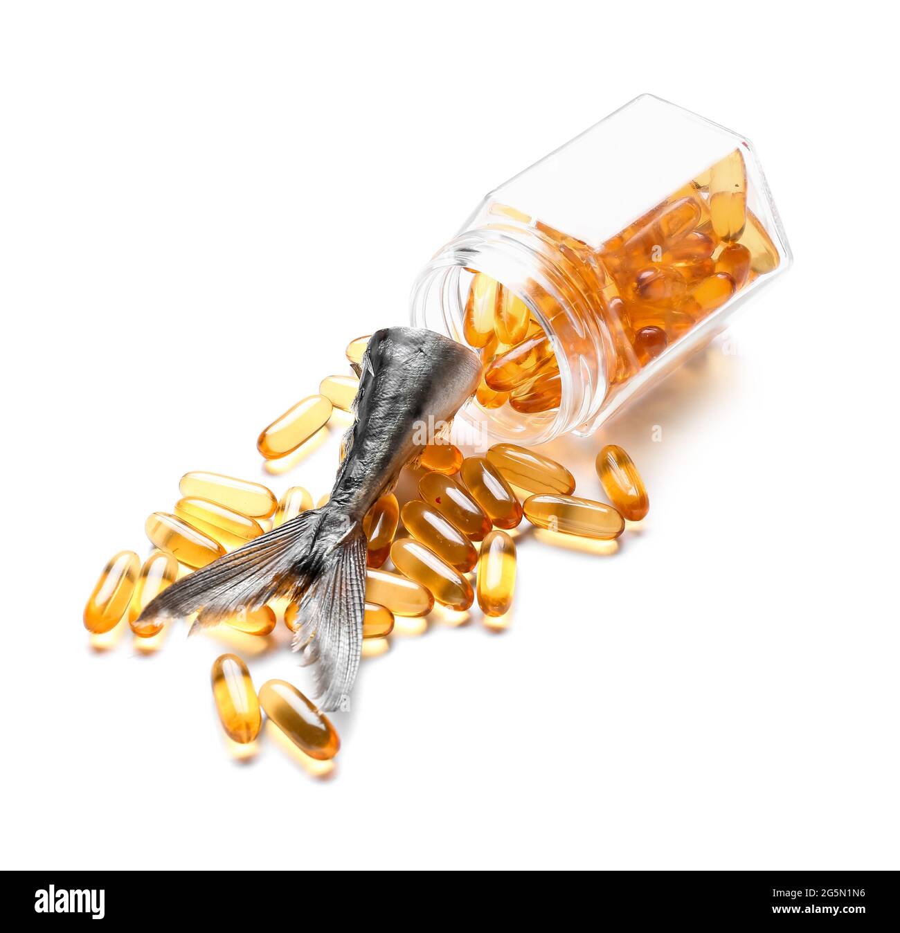 Fish oil pills and tail of a mackerel on white background Stock Photo ...