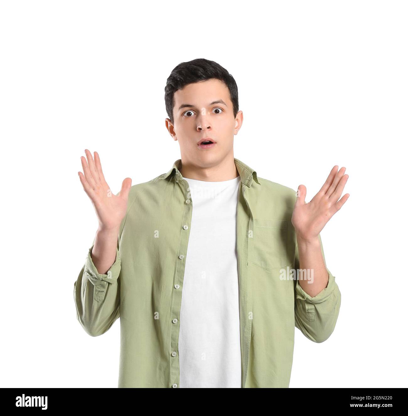 Shocked young man on white background Stock Photo - Alamy