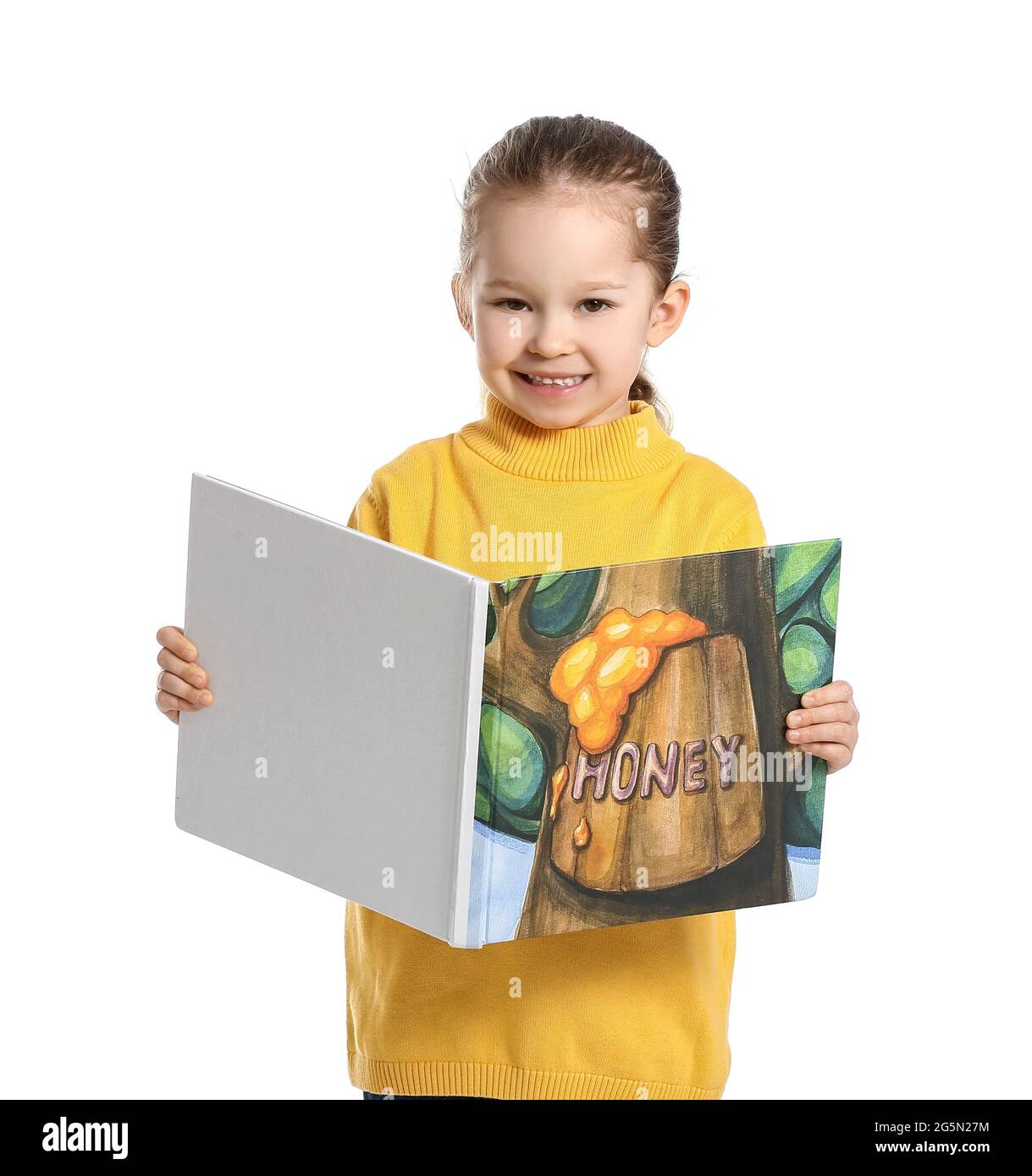 Cute little girl with book on white background Stock Photo - Alamy