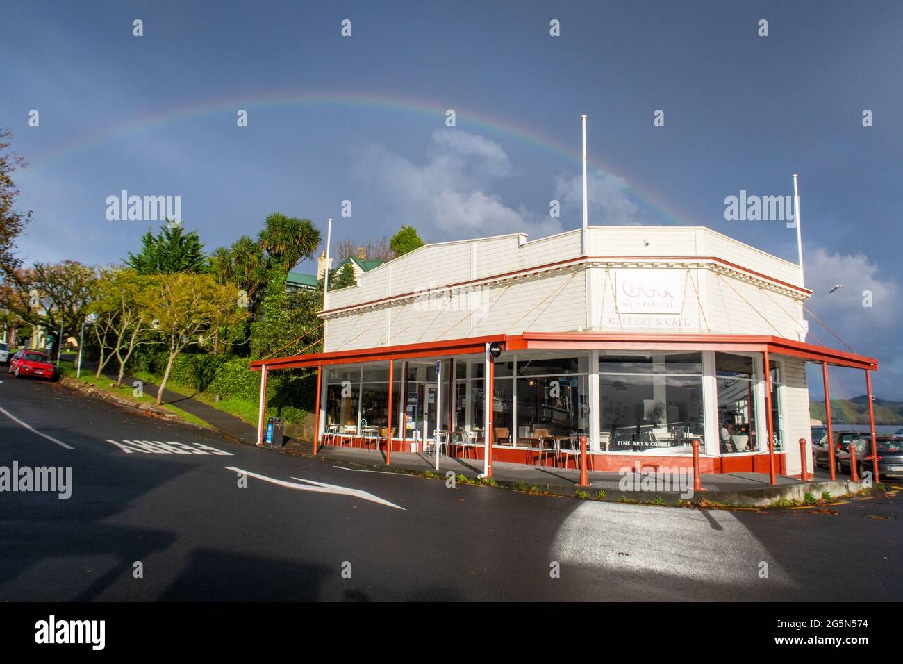 Rawene, North Island, New Zealand, June 20 2021: A rainbow brightens up ...